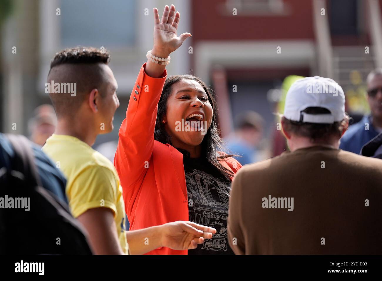 San Francisco Mayor London Breed, middle, waves at a Halloween event ...