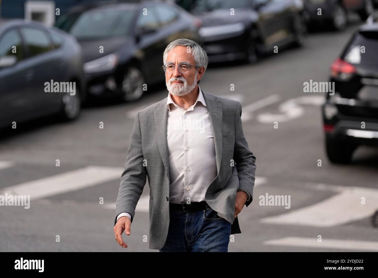 San Francisco mayoral candidate Aaron Peskin crosses the street while ...