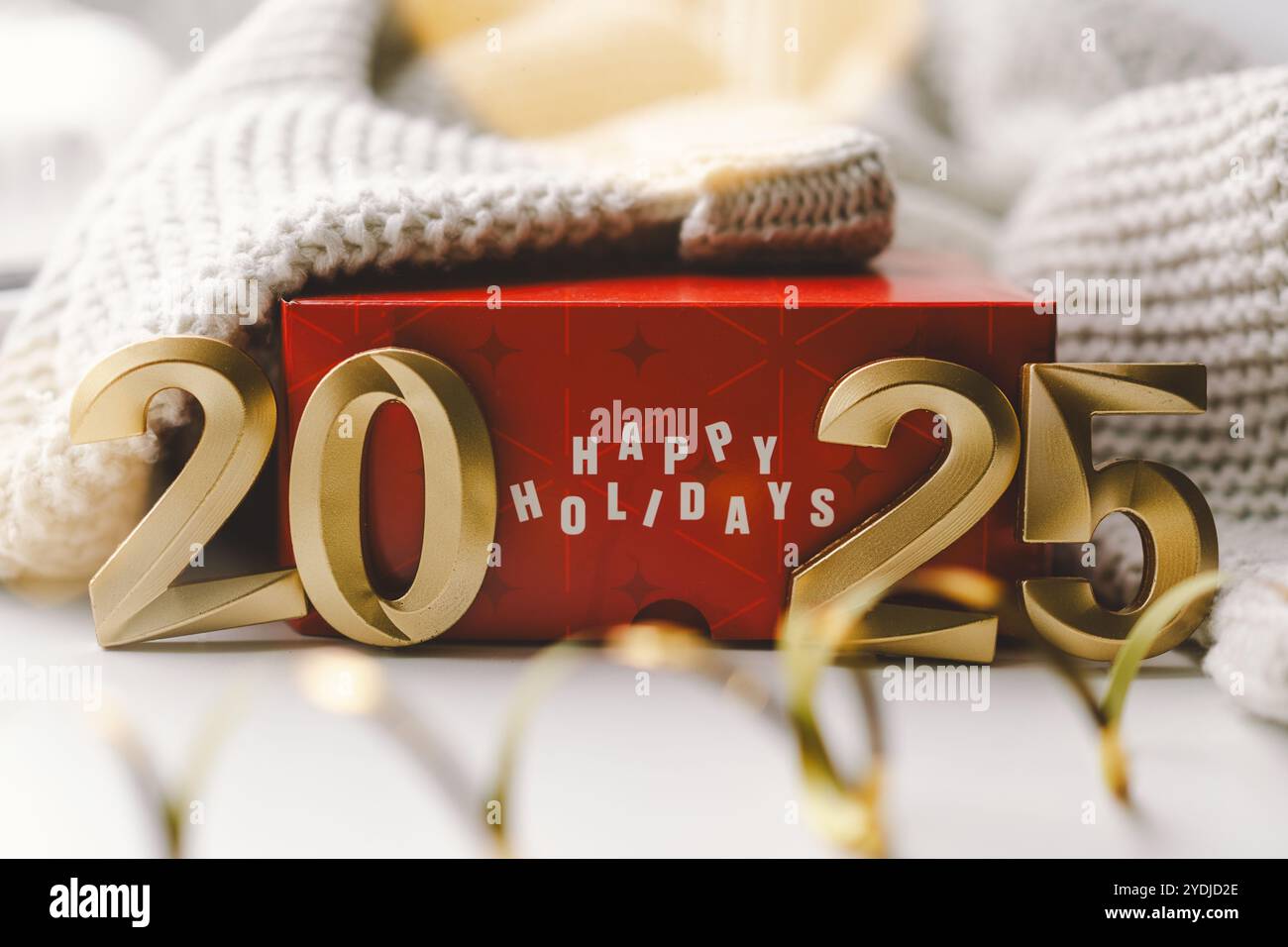 Red gift box with numbers revealing the New Year 2025, surrounded by ...