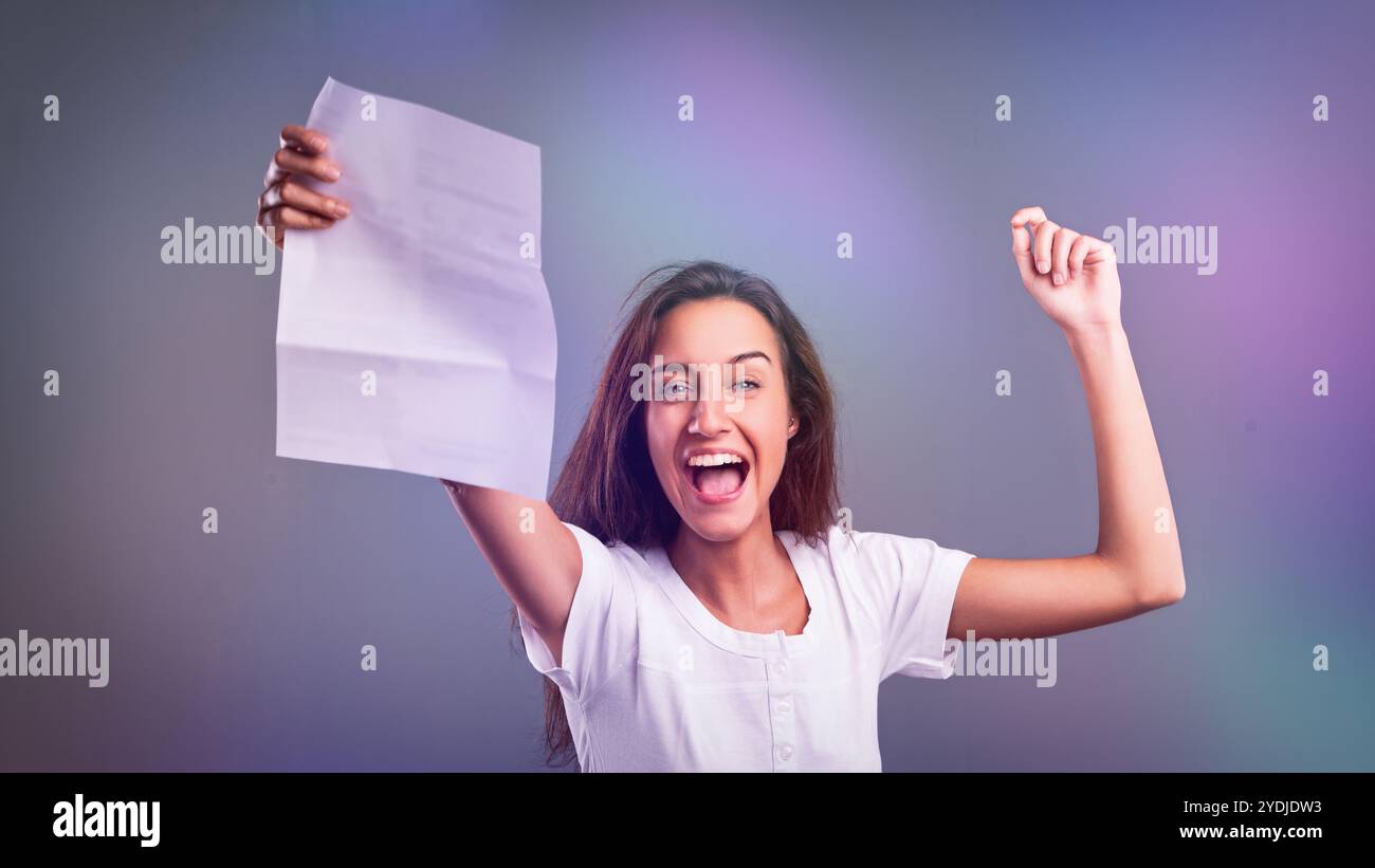 Excited young woman holding blank sheet of paper and celebrating ...