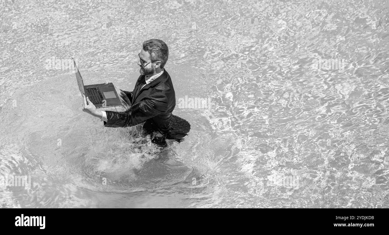 Businessman in suit with laptop in swimming pool. business man on ...