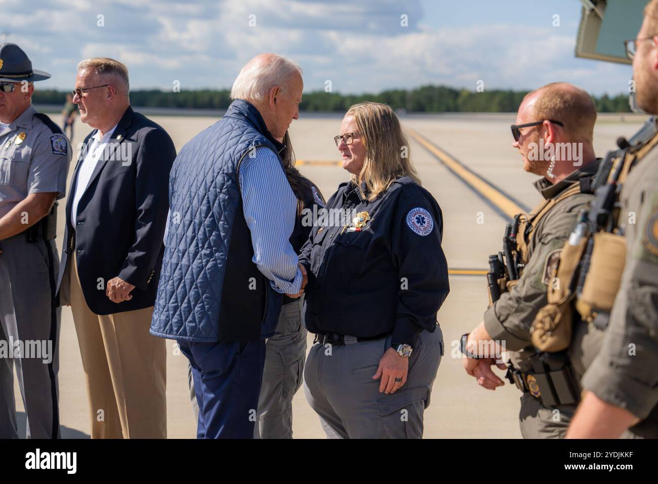 President Joe Biden greets law enforcement personnel before boarding ...