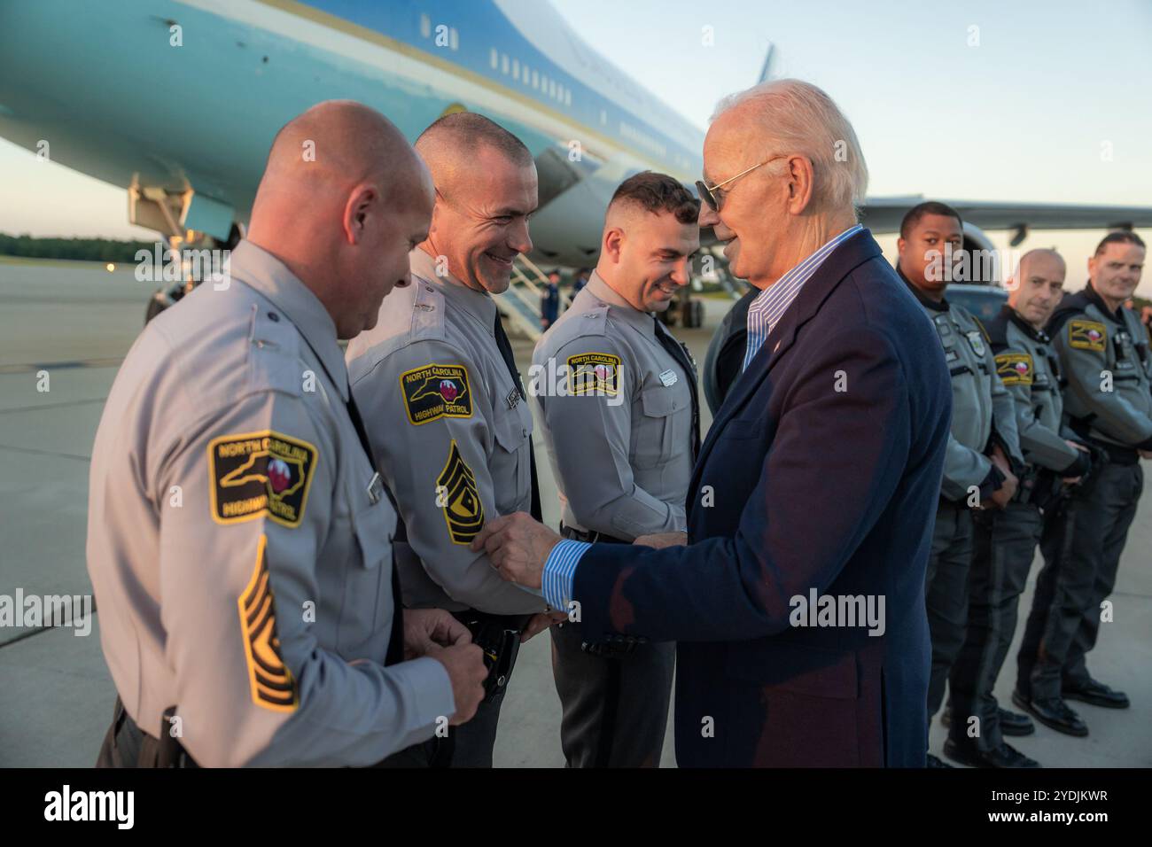 President Joe Biden greets motorcycle police at Raleigh-Durham ...