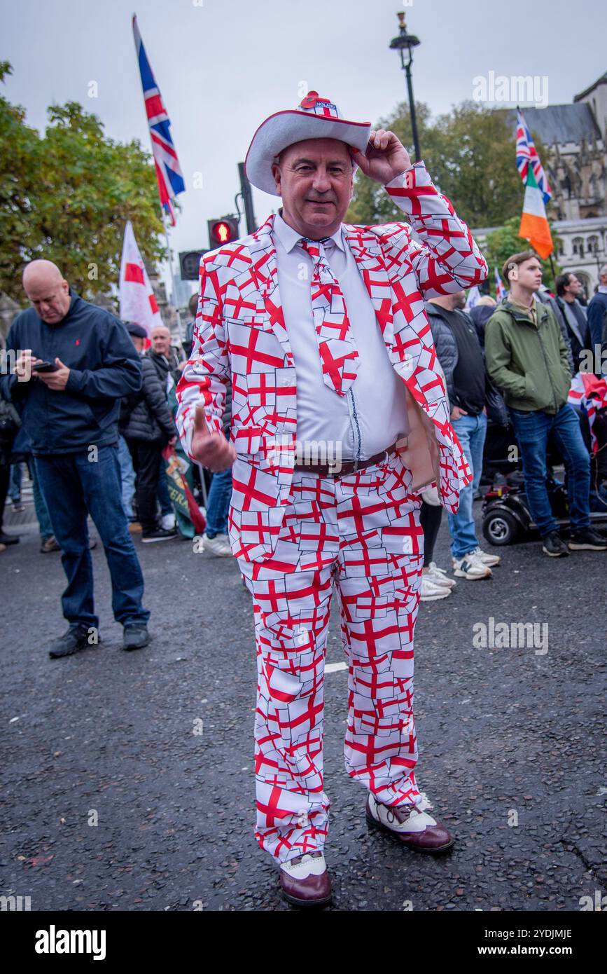 A protestor dressed in costume takes part during the demonstration ...
