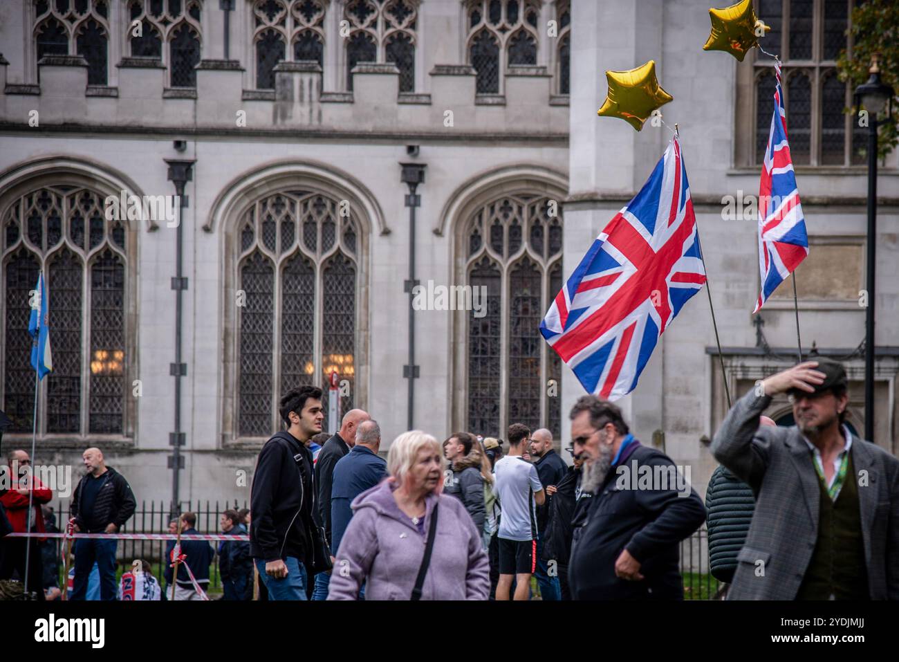Protestors gather during the demonstration. Tommy Robinson supporters ...