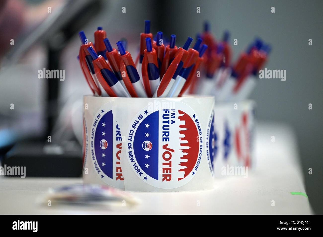 Stickers and pens at an early voting site inside The Shed at Hudson ...