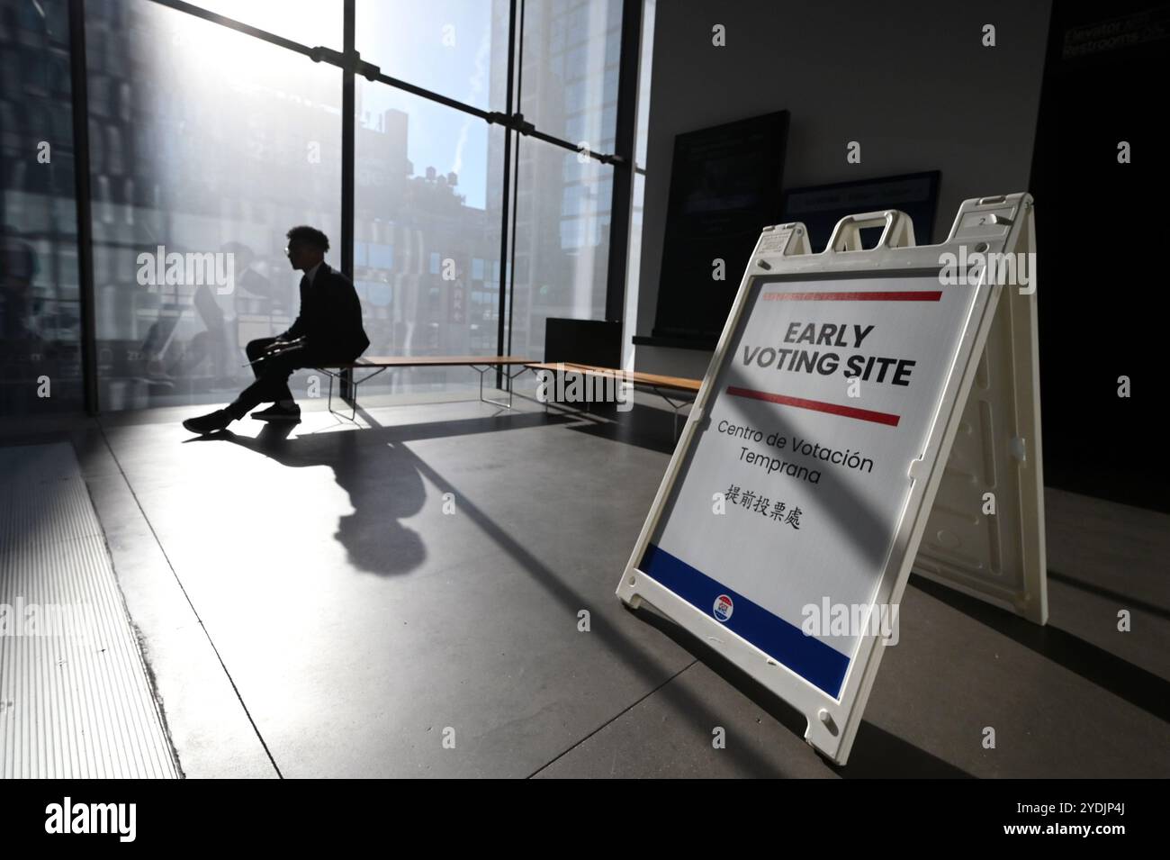 A security guard sits outside a early voting site inside The Shed at ...