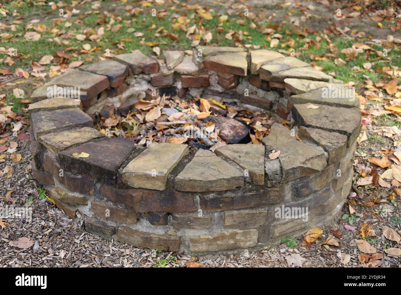 Outdoor stone block fire pit in public park or backyard Stock Photo - Alamy