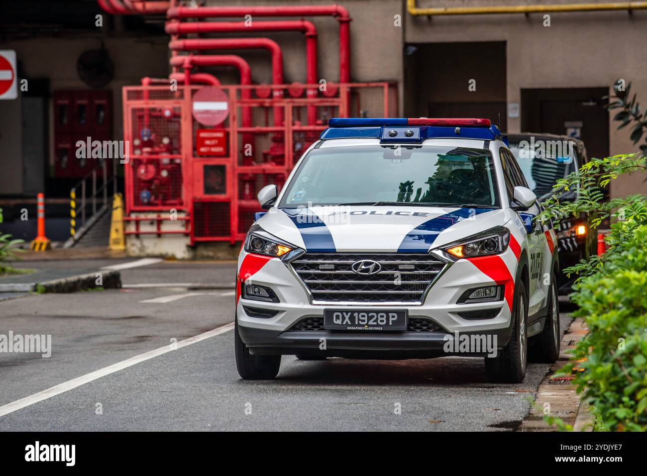 A Singapore Police car parked in a back street in central Singapore ...