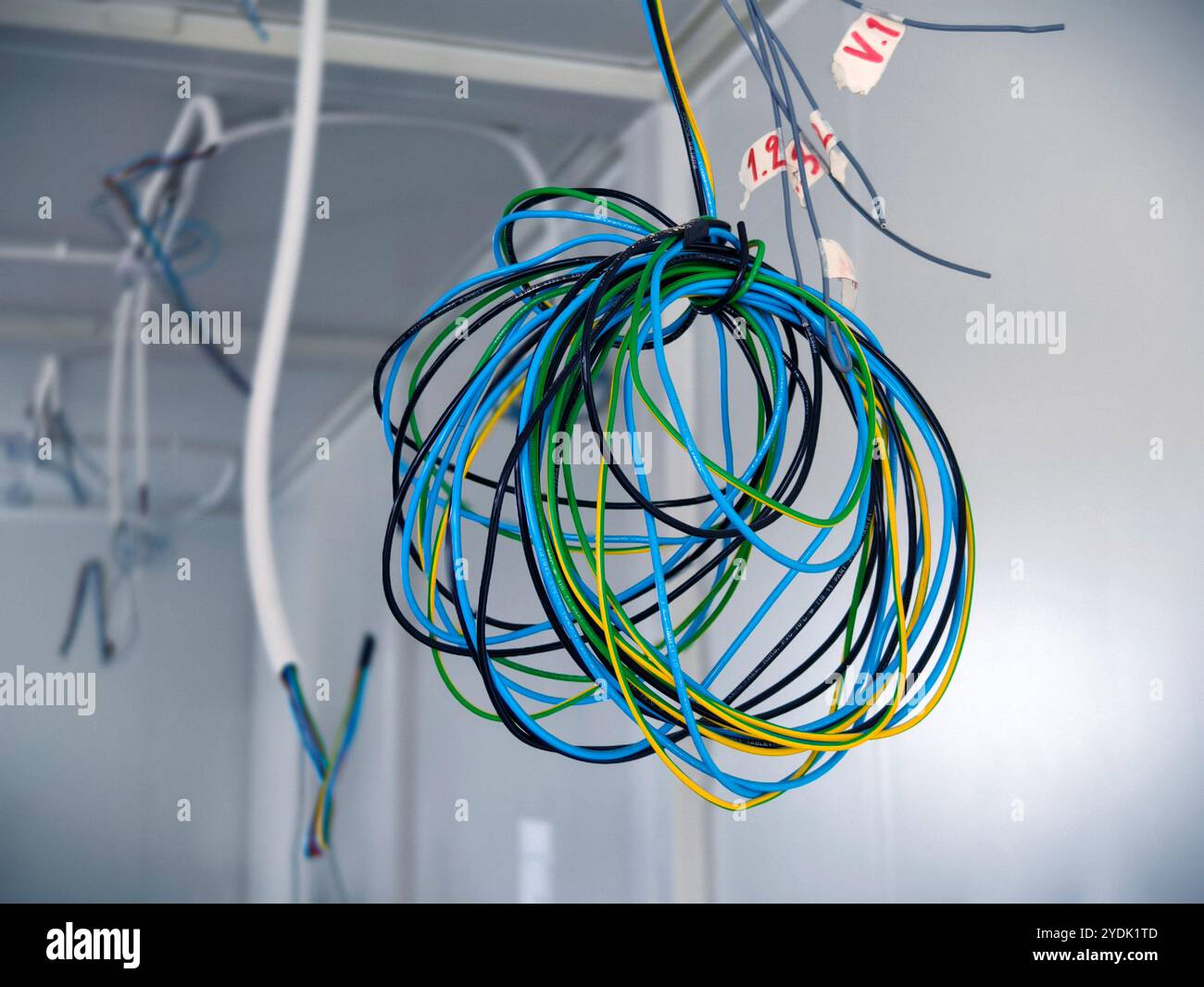 A collection of various wires is hanging down from the ceiling Stock ...
