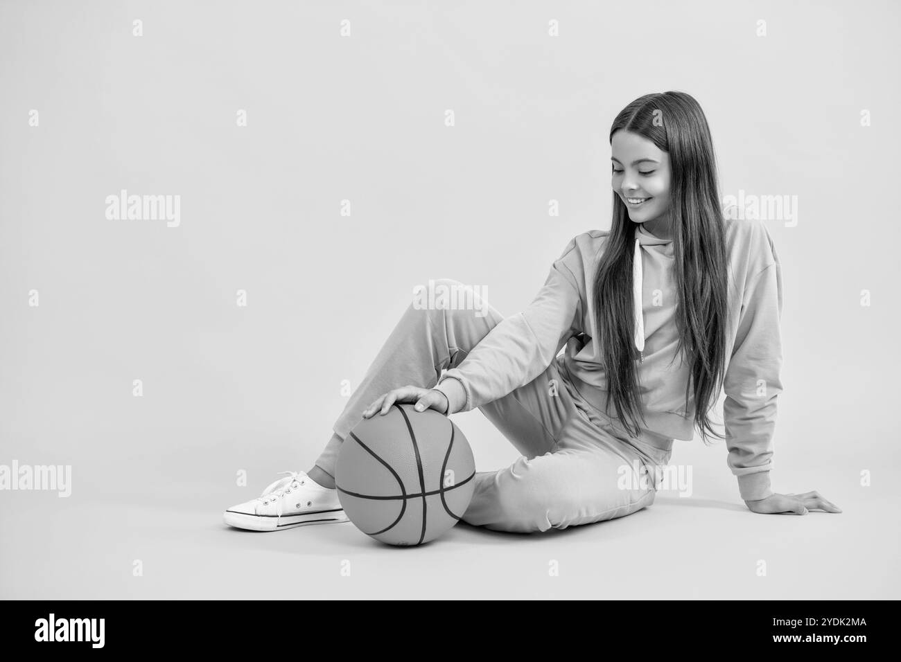 Teen girl excelling in basketball. Skilled teen girl playing the ...