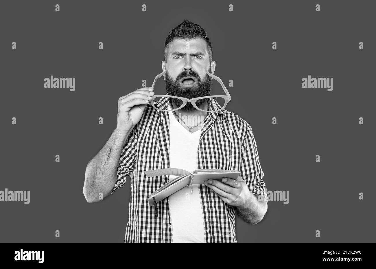 funny shocked man in party glasses reading book Stock Photo - Alamy