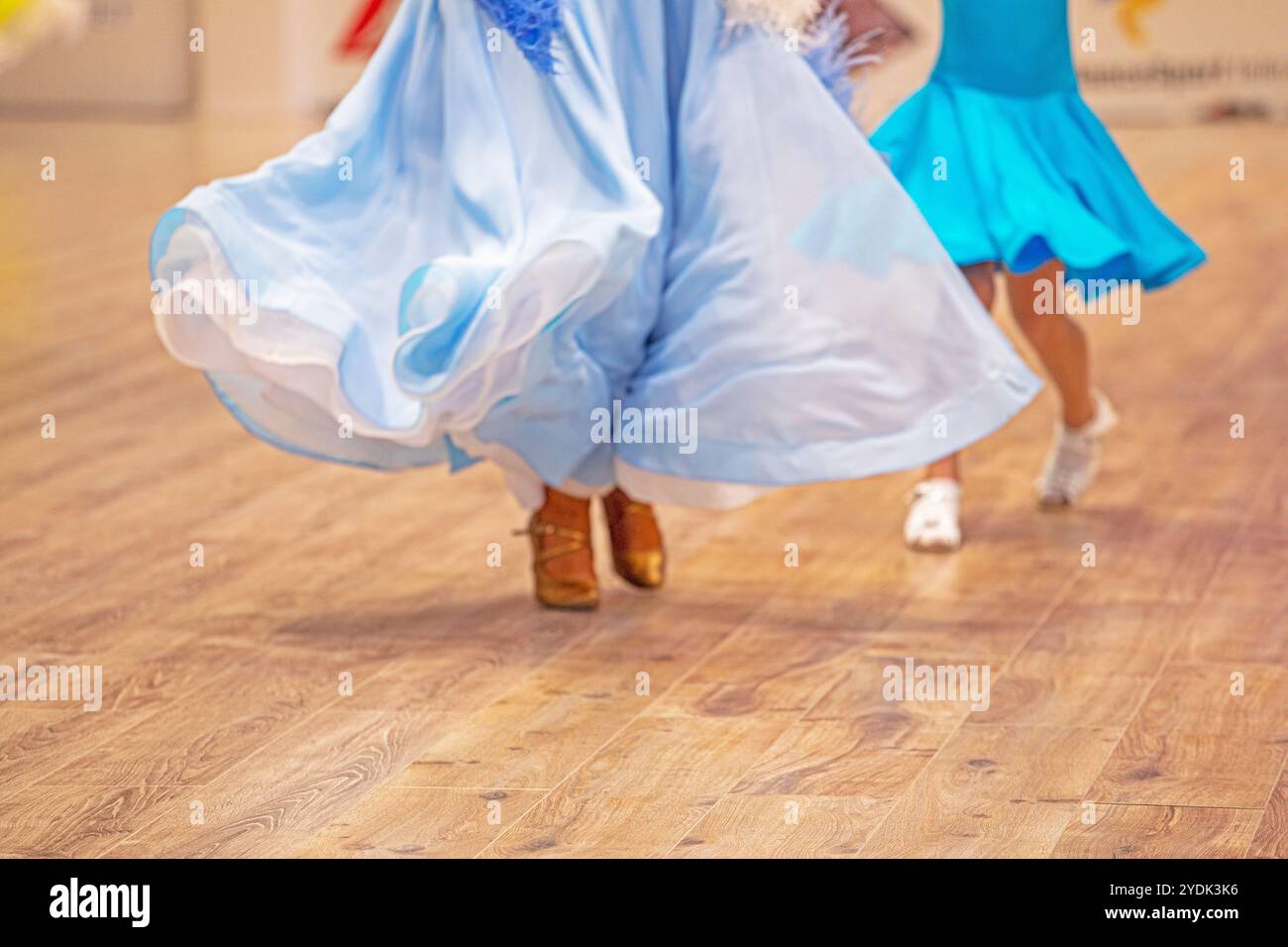 girl in a light blue dance dress dances on the dance floor at the ...