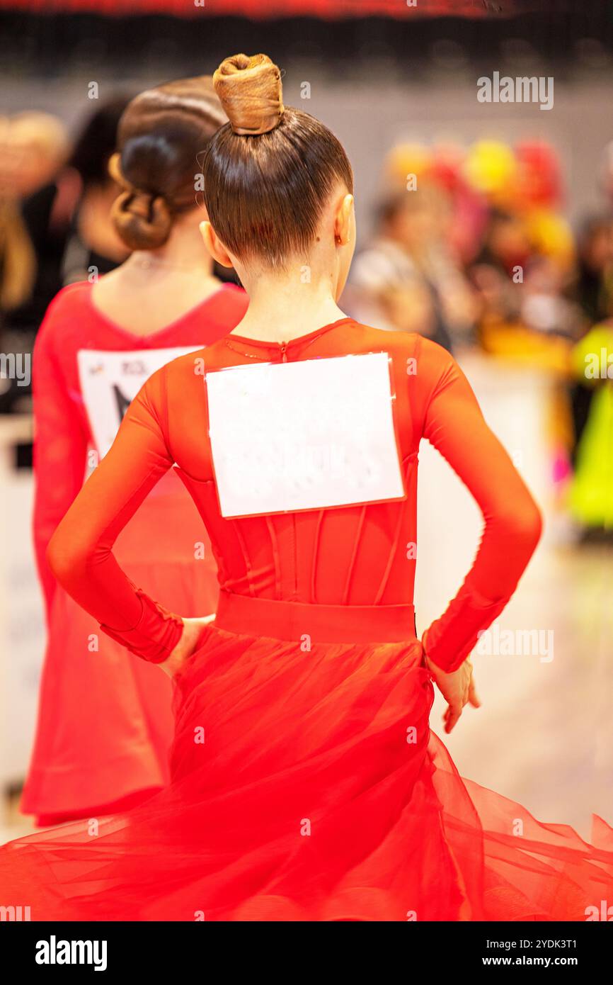 back of head happy girl with slicked back and wet wave hairdo dances ...
