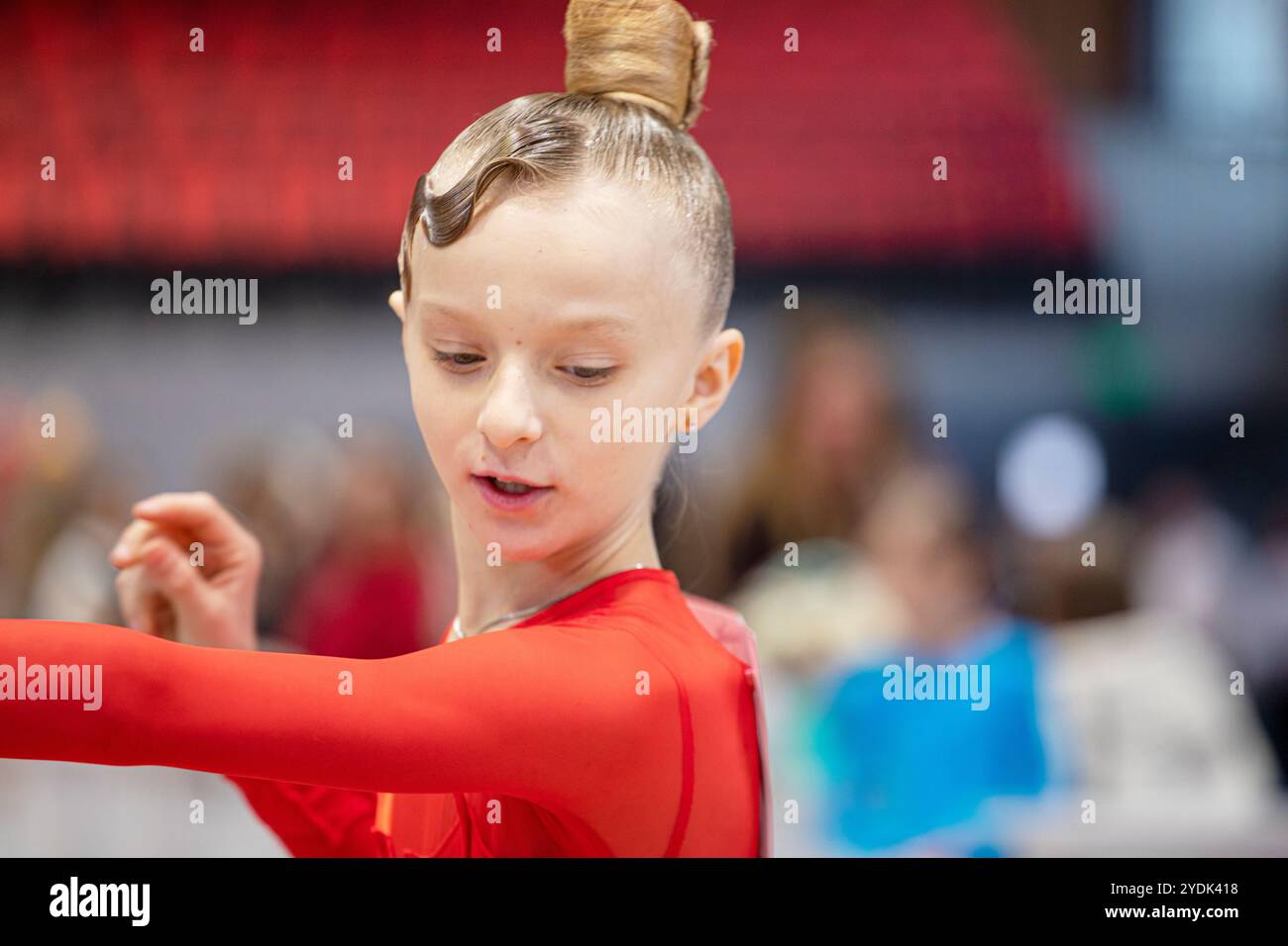 happy girl with slicked back and wet wave hairdo dances solo at ...