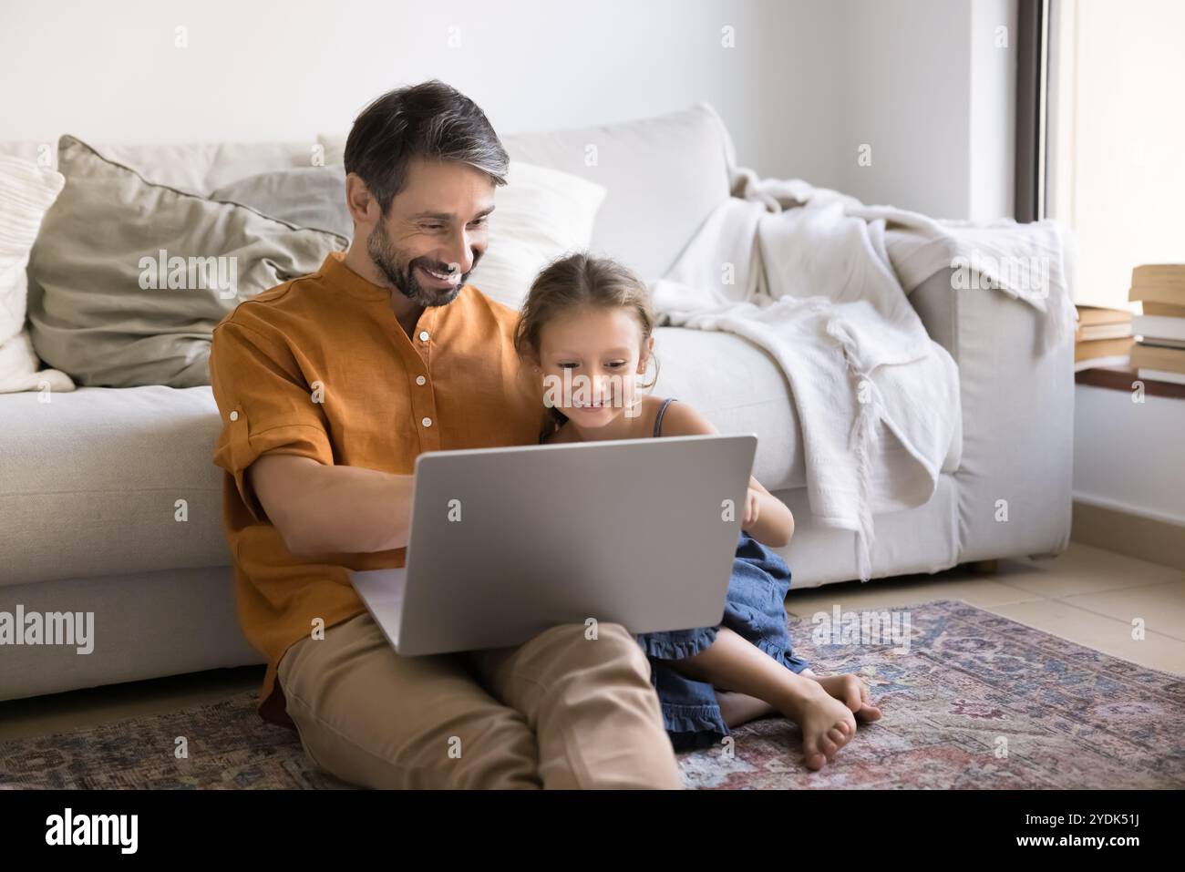 Positive father and beautiful little daughter kid using learning ...