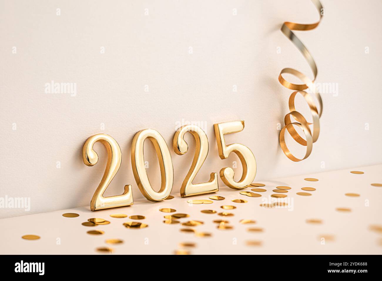 New Year's celebration decoration featuring golden 2025 numbers ...