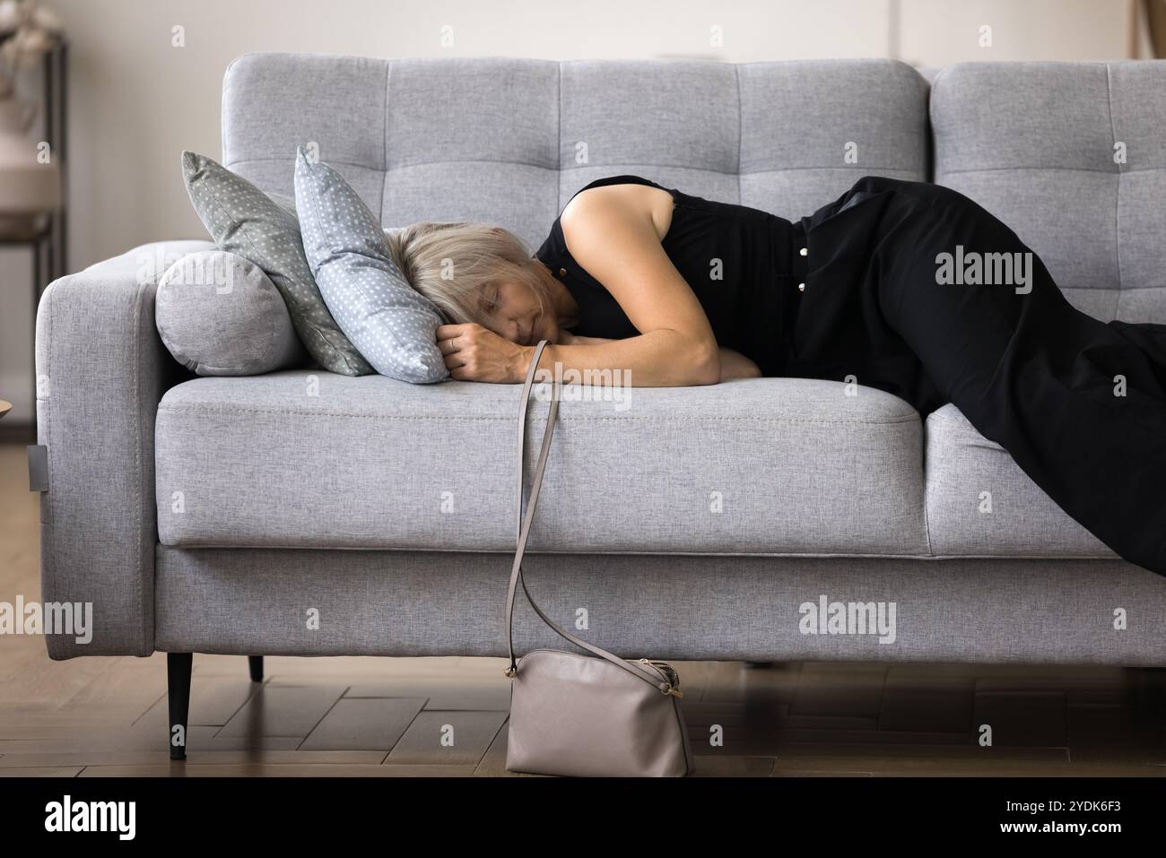 Exhausted woman couch rest energy hi-res stock photography and images ...