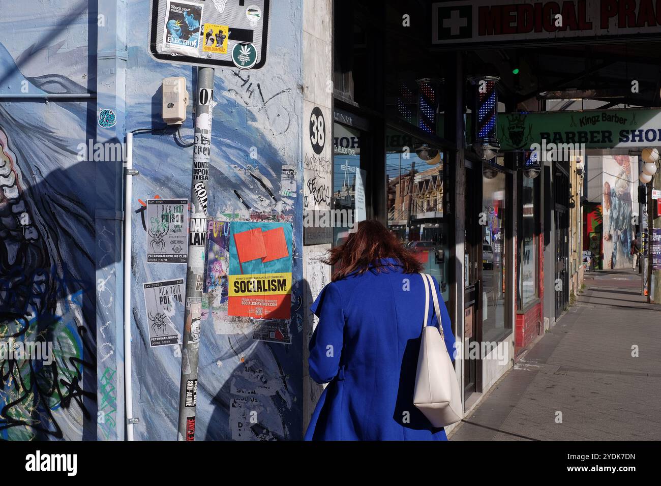 Posters on buildings 'Socialism' and streetscape along Enmore Road, in ...