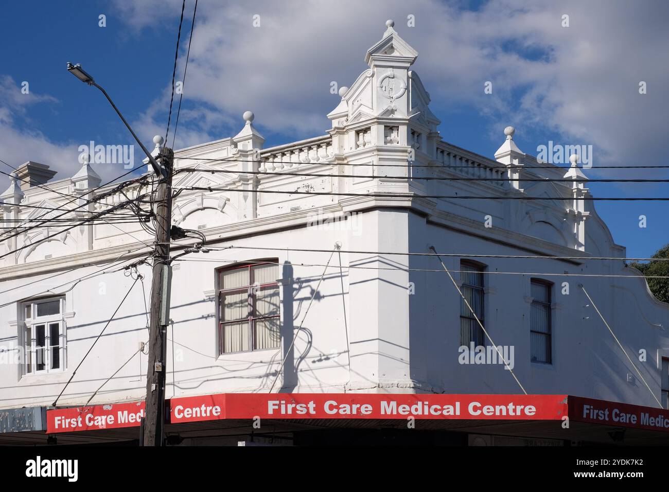 Late Victorian street architecture, corner building parapet and power ...