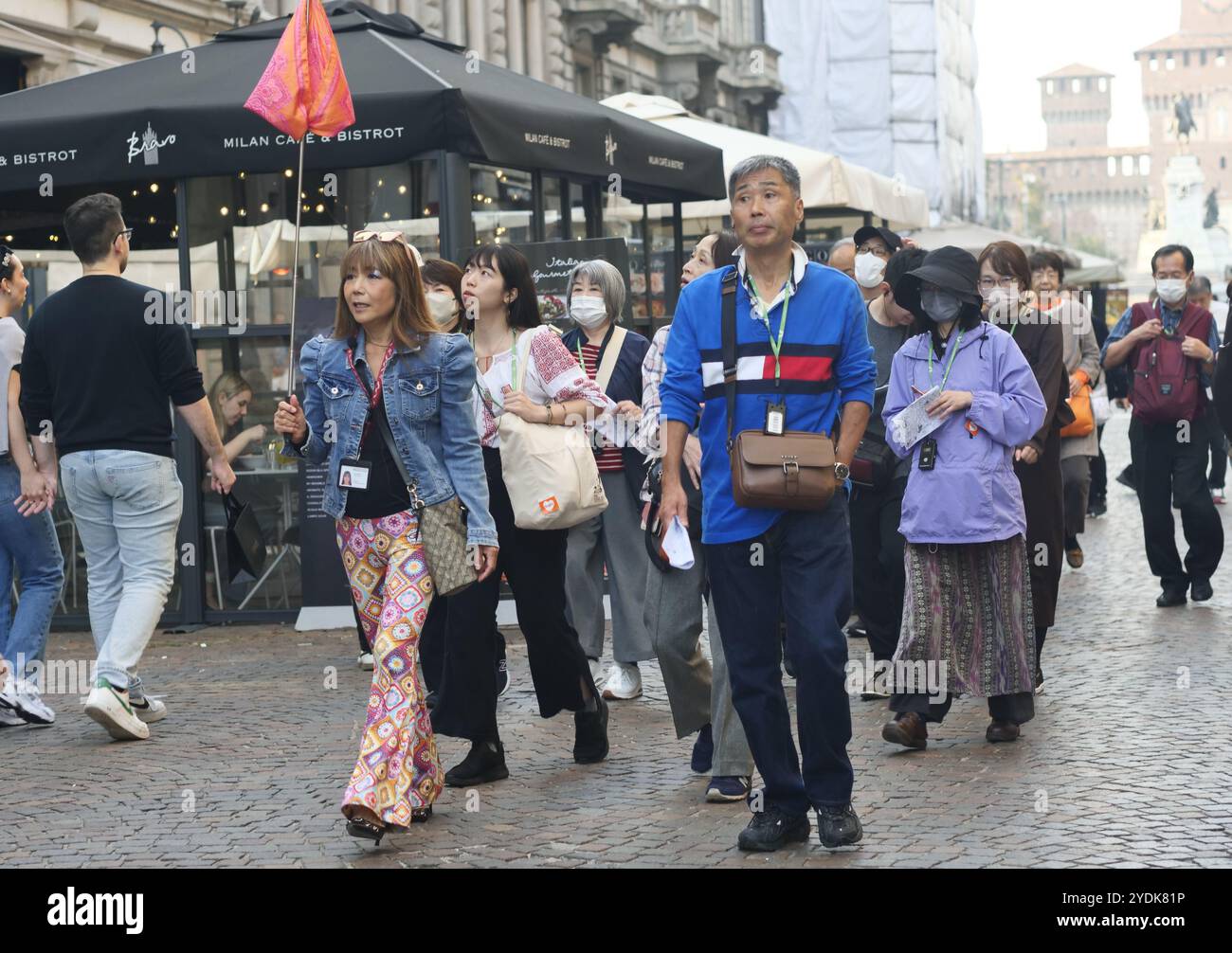 Many groups of Asian tourists visit the city of Milan, the world ...