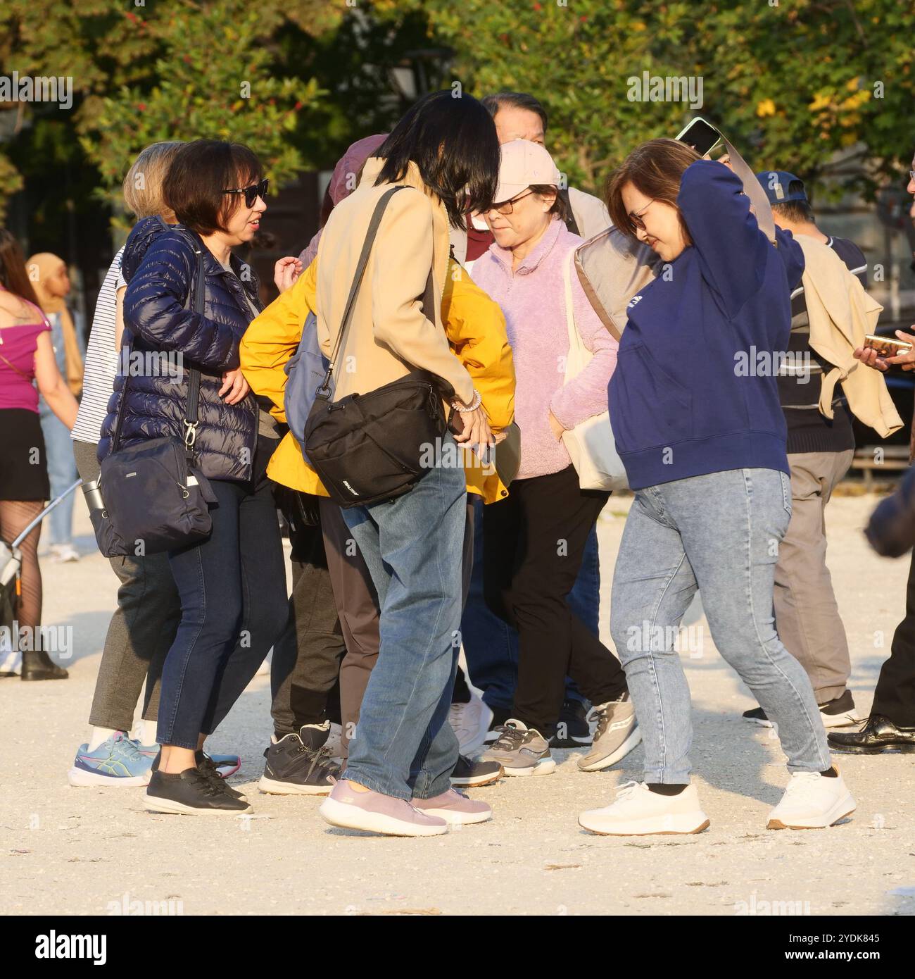 Many groups of Asian tourists visit the city of Milan, the world ...