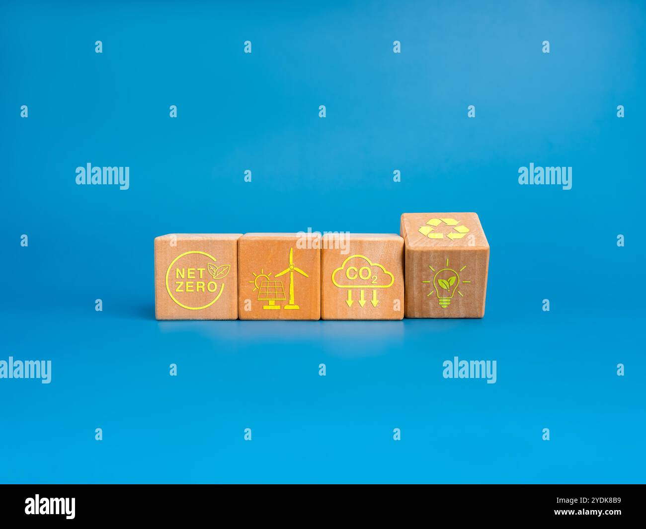 Net Zero icon and green renewable energy symbol on wooden cube blocks ...