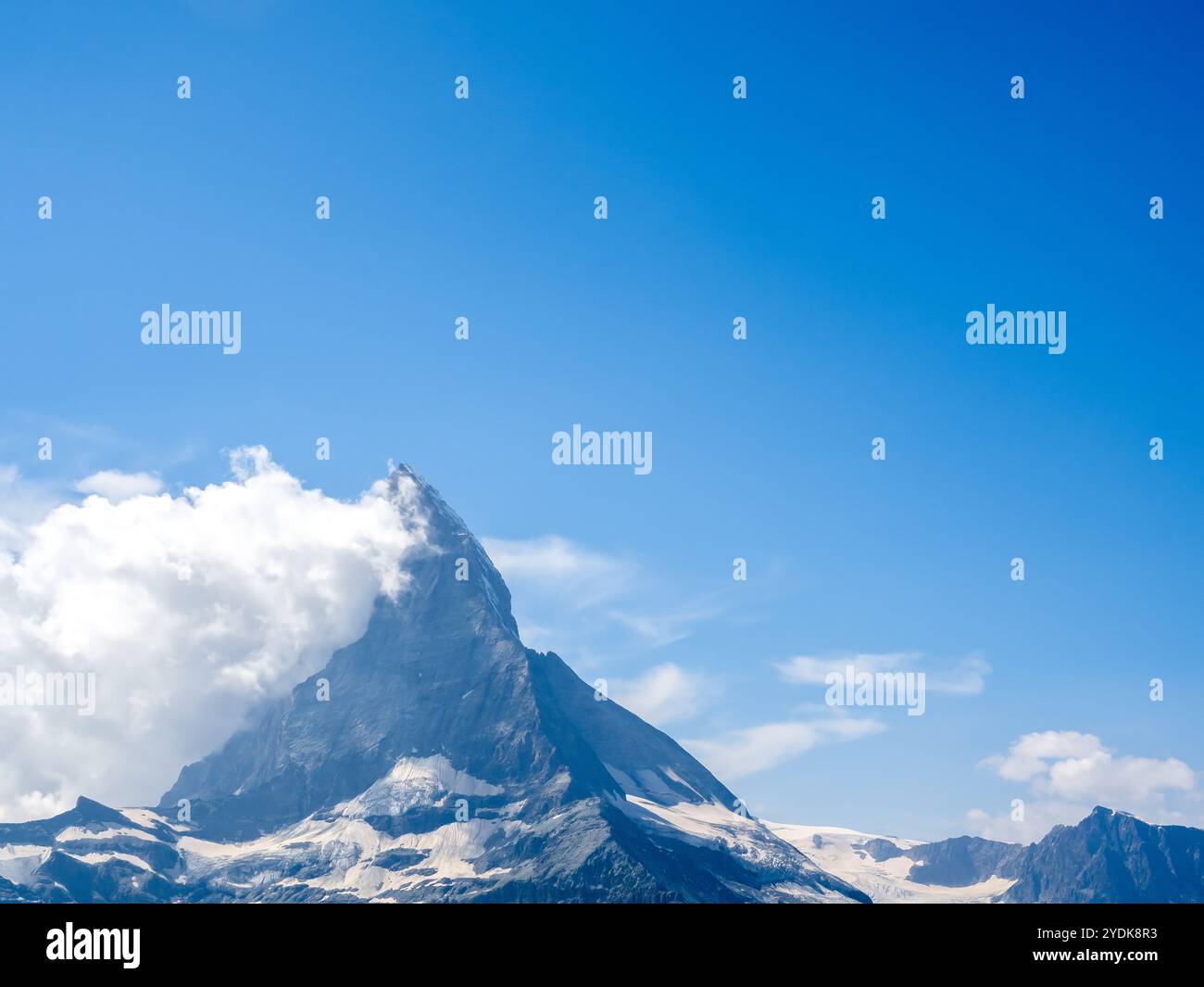 Background of blue sky with the great Matterhorn in the Swiss Alps ...