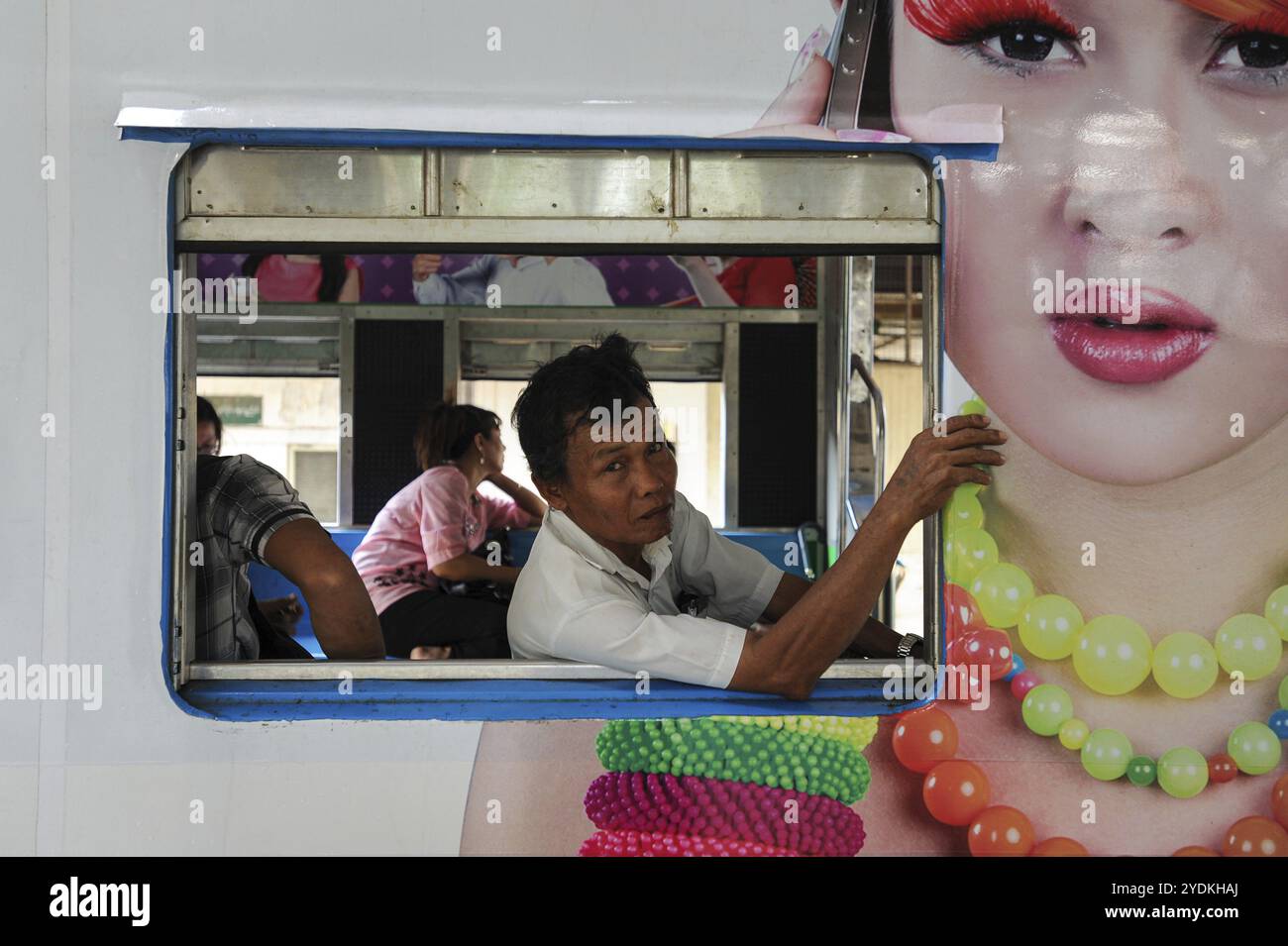 10.04.2014, Yangon, Republic of the Union of Myanmar, Asia, A man looks ...