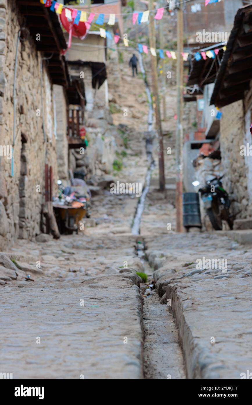 Peru - Tupe, October 23, 2022. Traditional drainage system lines the ...
