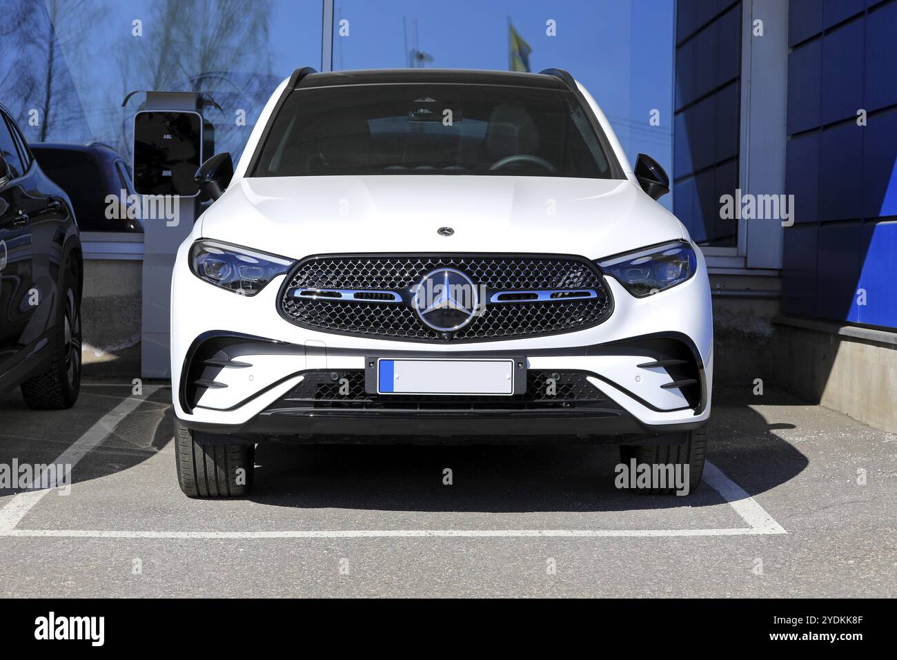 New white Mercedes-Benz 4matic luxury SUV car parked, DEFA charger for ...