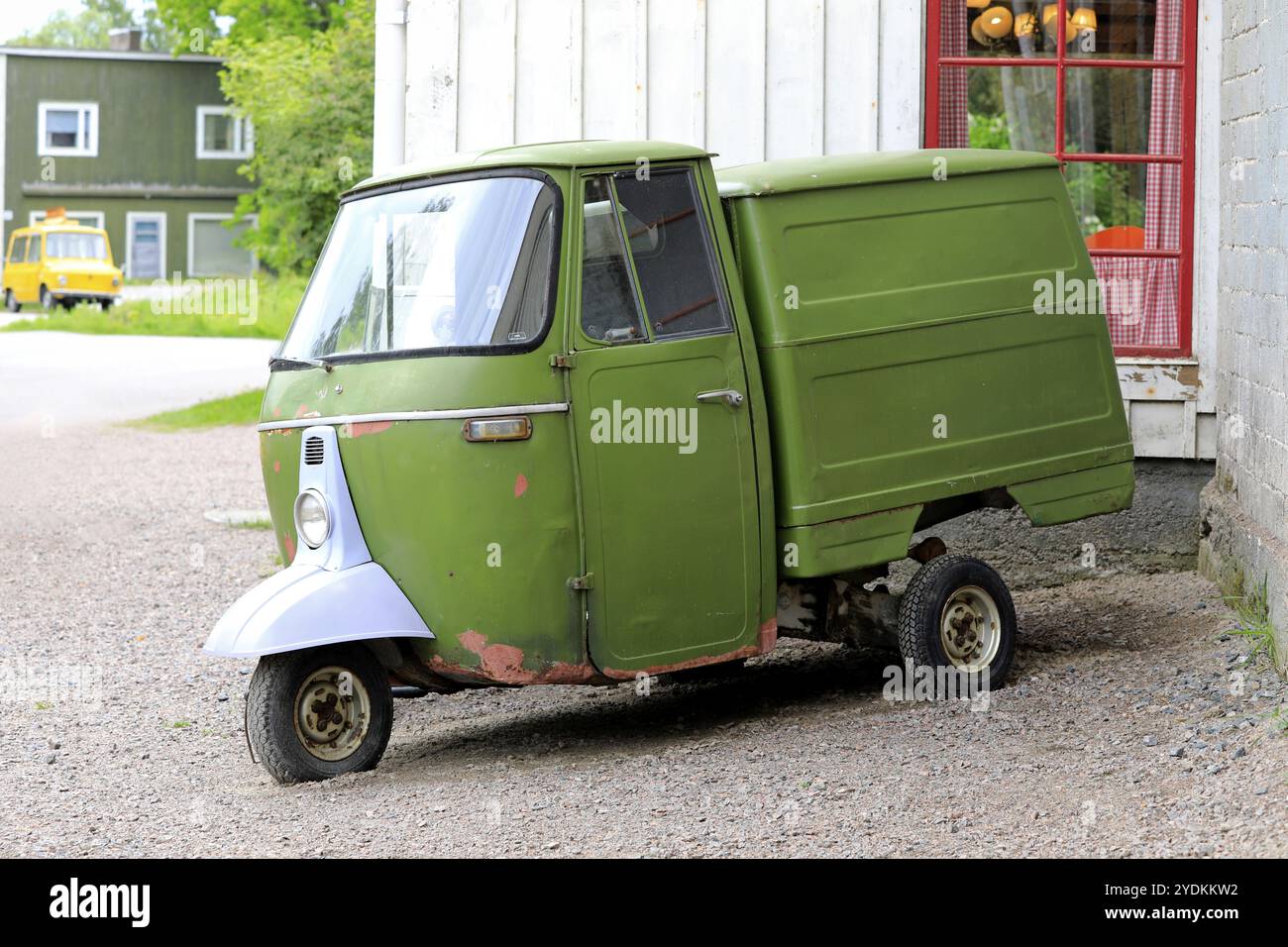 Green Piaggio Ape three-wheeled light commercial vehicle, marketed as ...