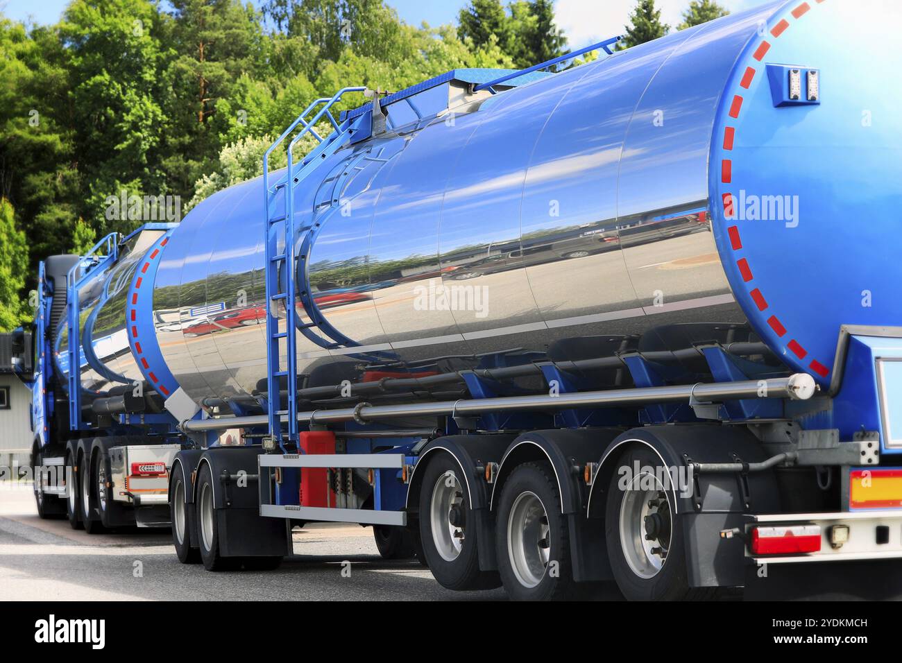 Rear view detail of a parked blue truck with clear tank trailers Stock ...