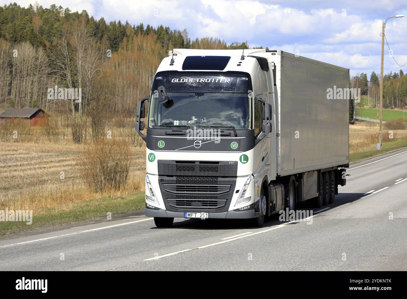 White Volvo FH truck, Globetrotter cab, pulls refrigerated semi trailer ...