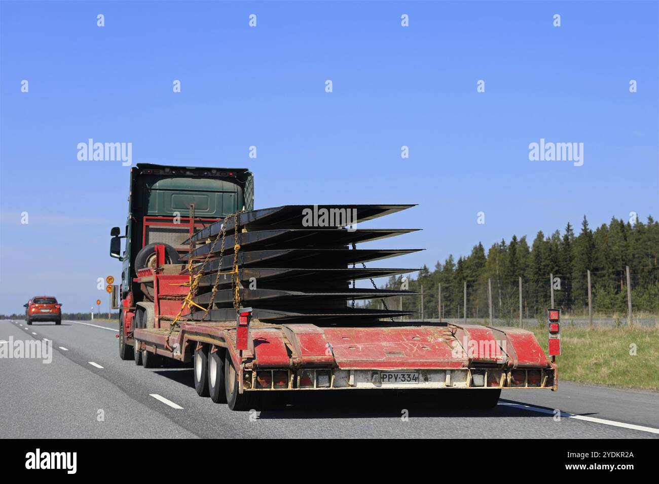 Rear view of Scania semi trailer road transport of industrial objects ...