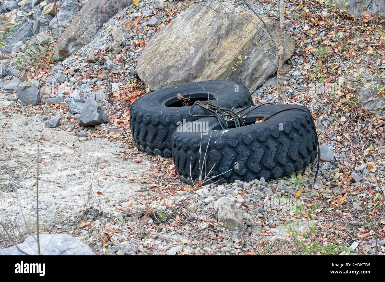 Abandoned tires for heavy equipment in a closed rock quarry Stock Photo ...
