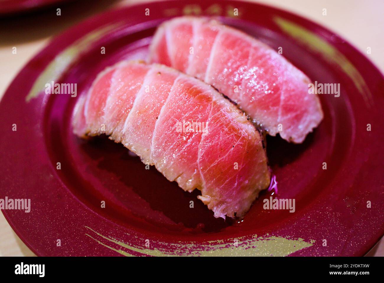 Japanese fresh Maguro Maki with Japanese rice in red plate Stock Photo ...