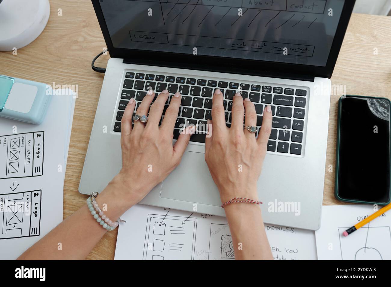 Designing Prototype with Laptop and Papers on Desk Stock Photo - Alamy