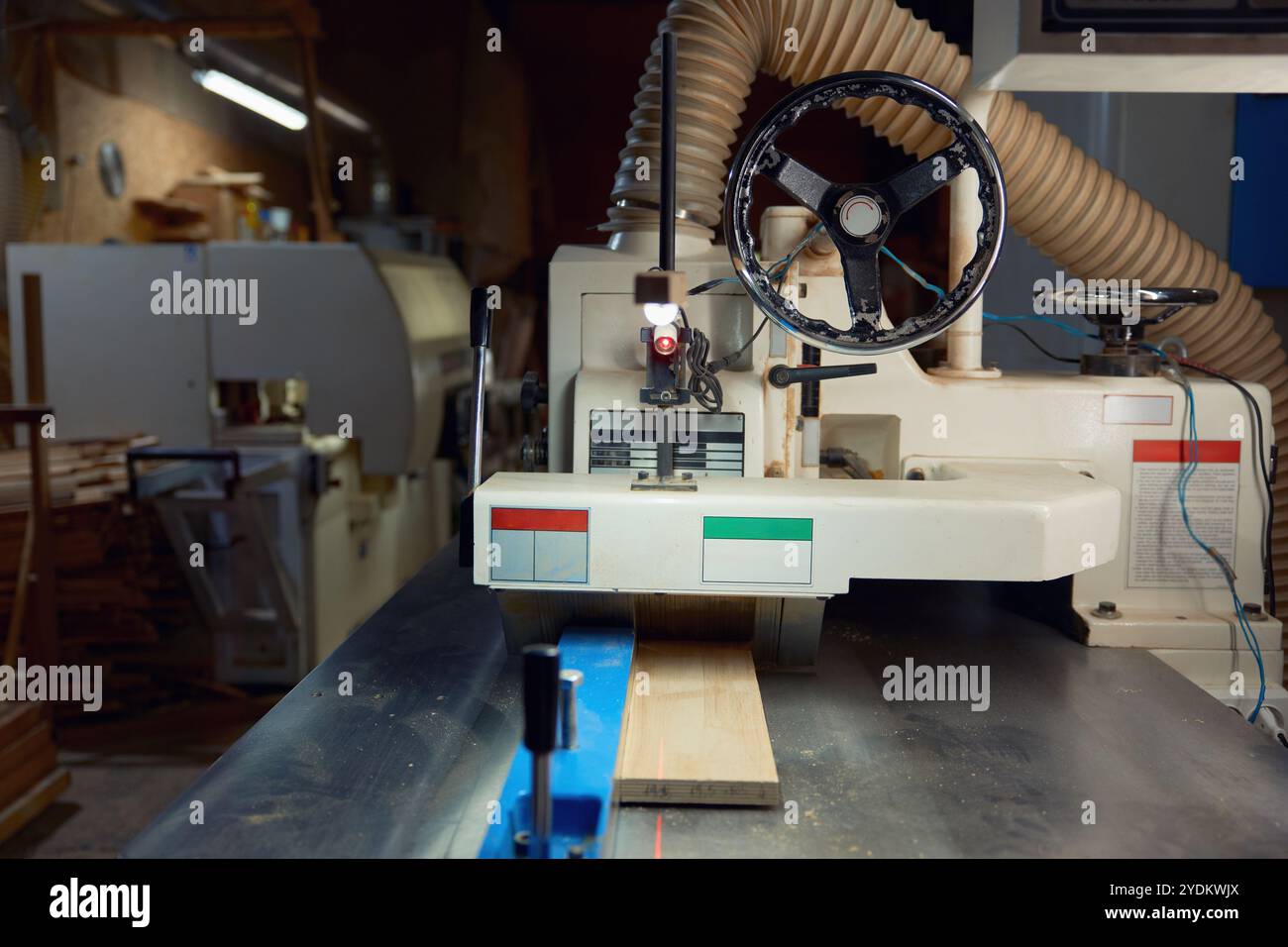Woodworking thickness planer machine to trim wood plank closeup view ...