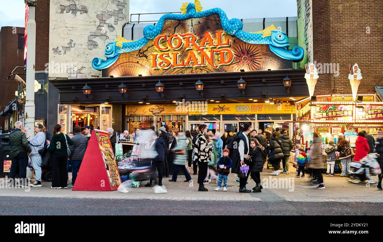 Crowds infront of Coral Island amusements arcade on Blackpool Promenade ...