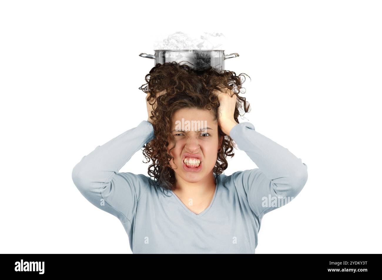 Portrait of a young girl with a boiling pot on her head, isolated on a ...