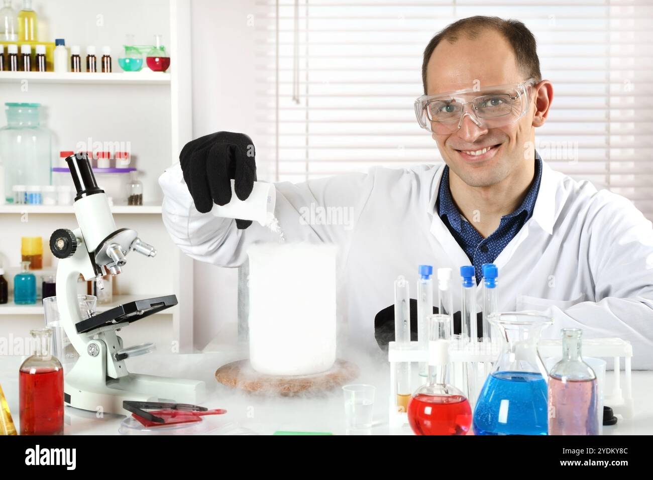 A young scientist experiments with dry ice and liquid nitrogen in the ...