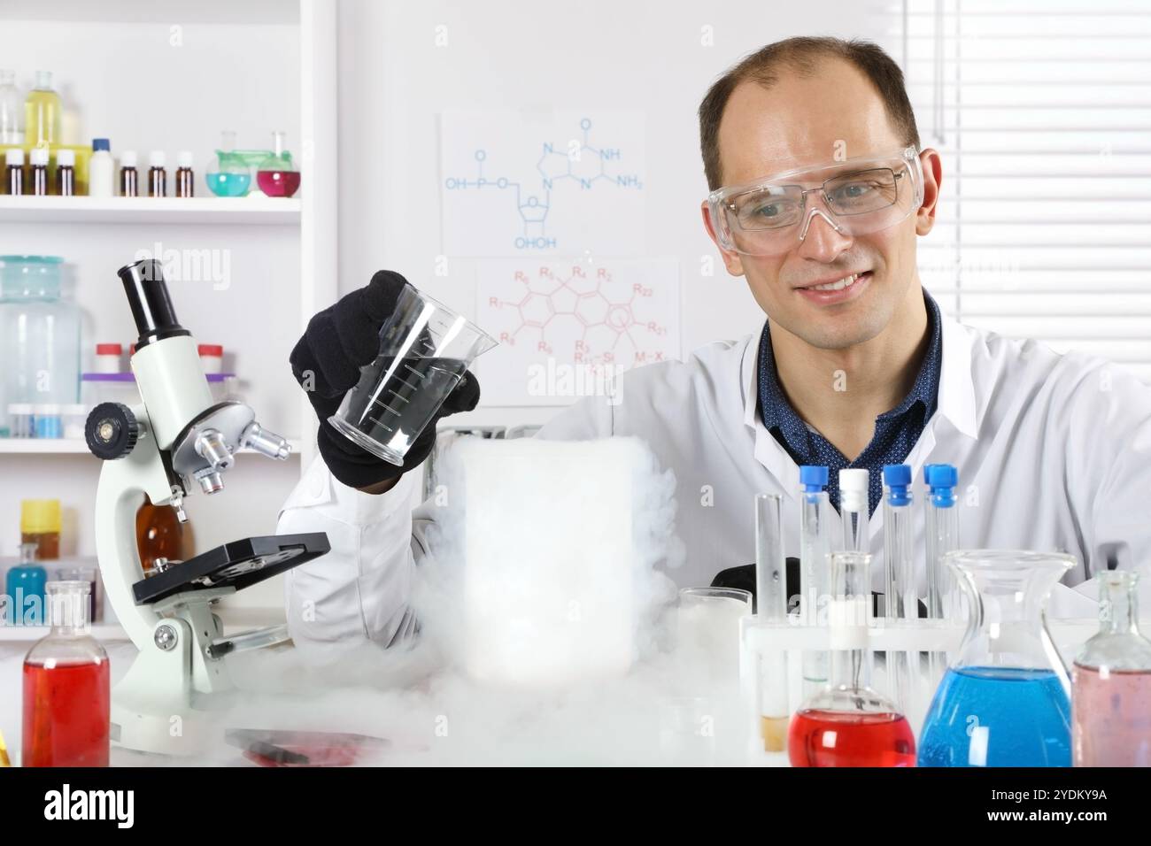 A young scientist experiments with dry ice and liquid nitrogen in a ...