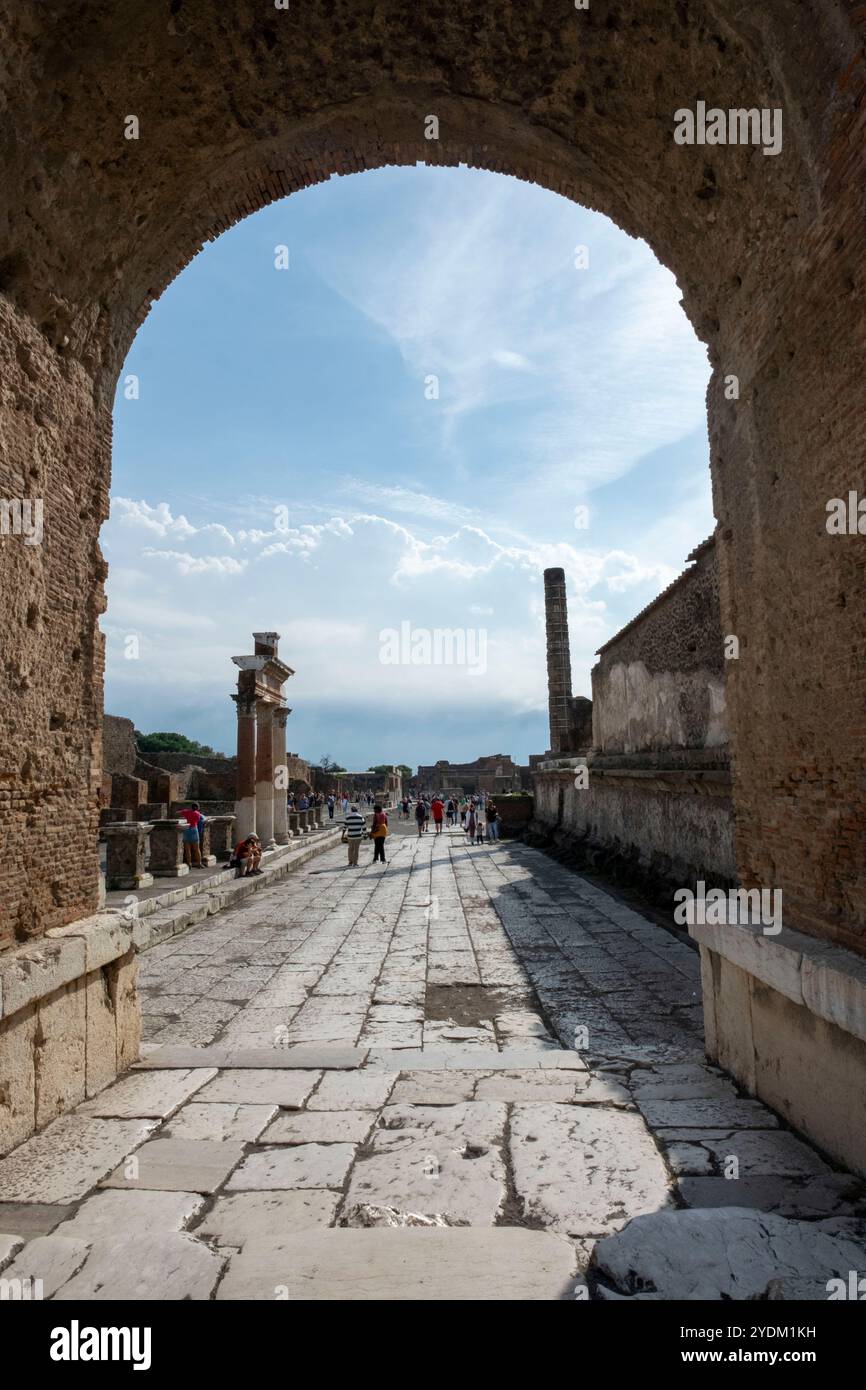 Stone arch and paved street leading to the main square in the ...