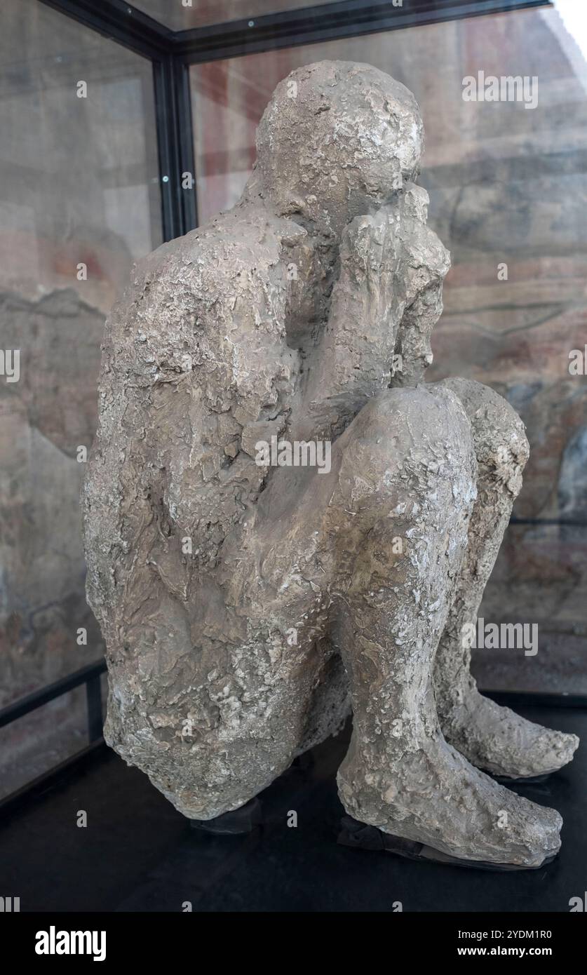 Plaster cast of a victim of the eruption in the Macellum (marketplace ...
