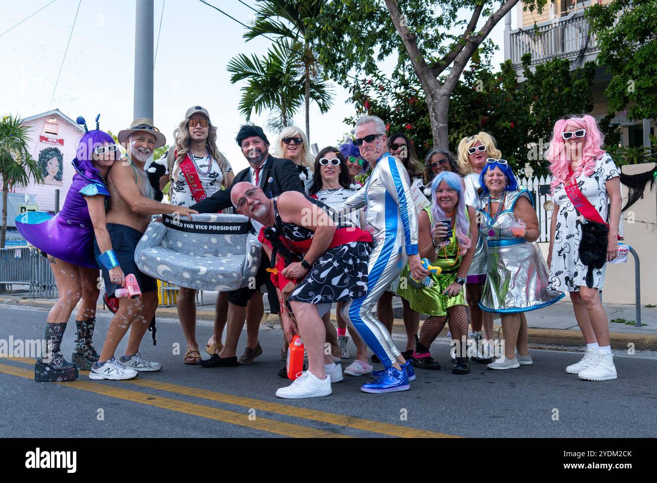 Key West, United States. 25th Oct, 2024. Costumed revelers pose for a ...