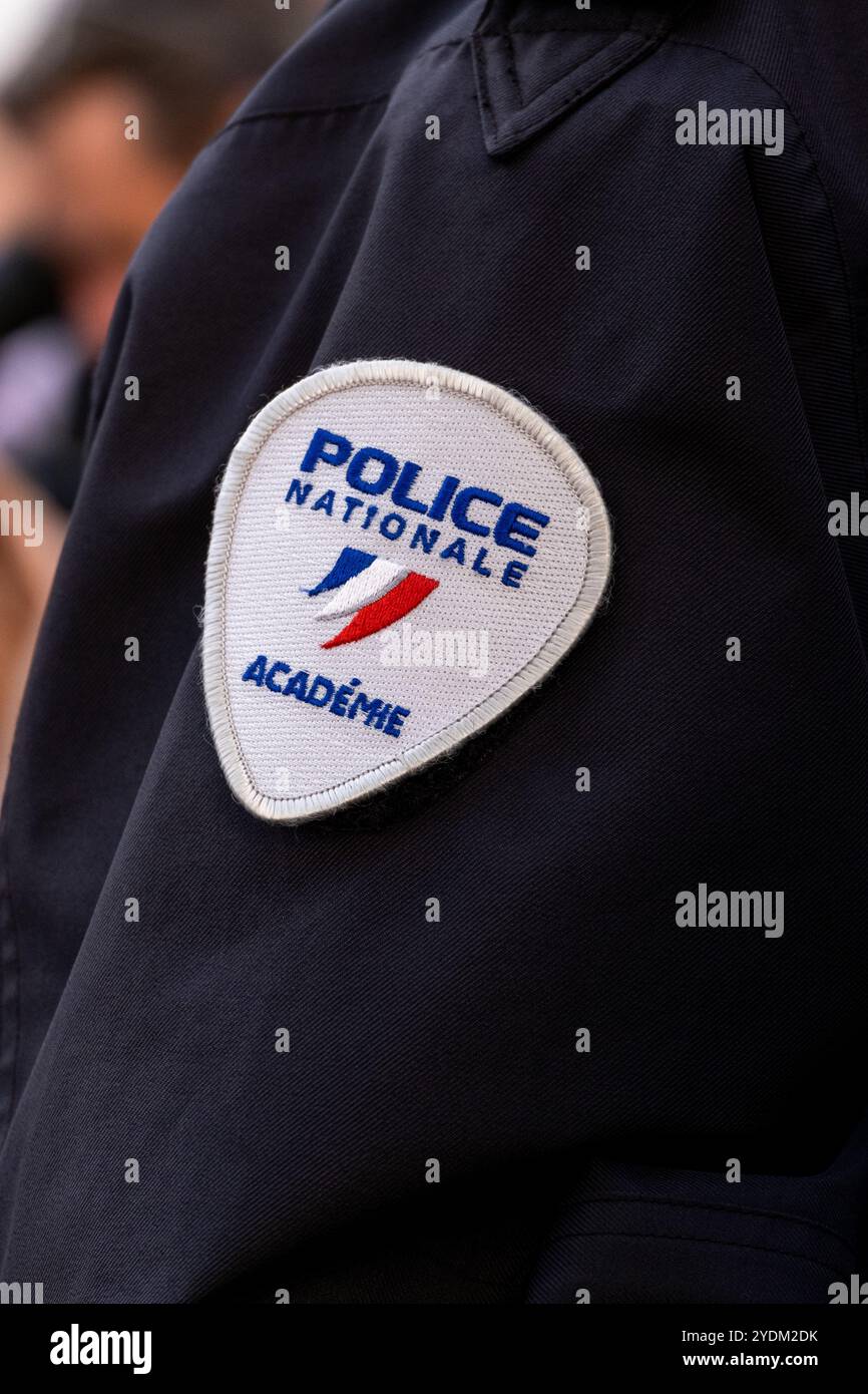 Academie de Police Nationale badge on the arm of a student police ...