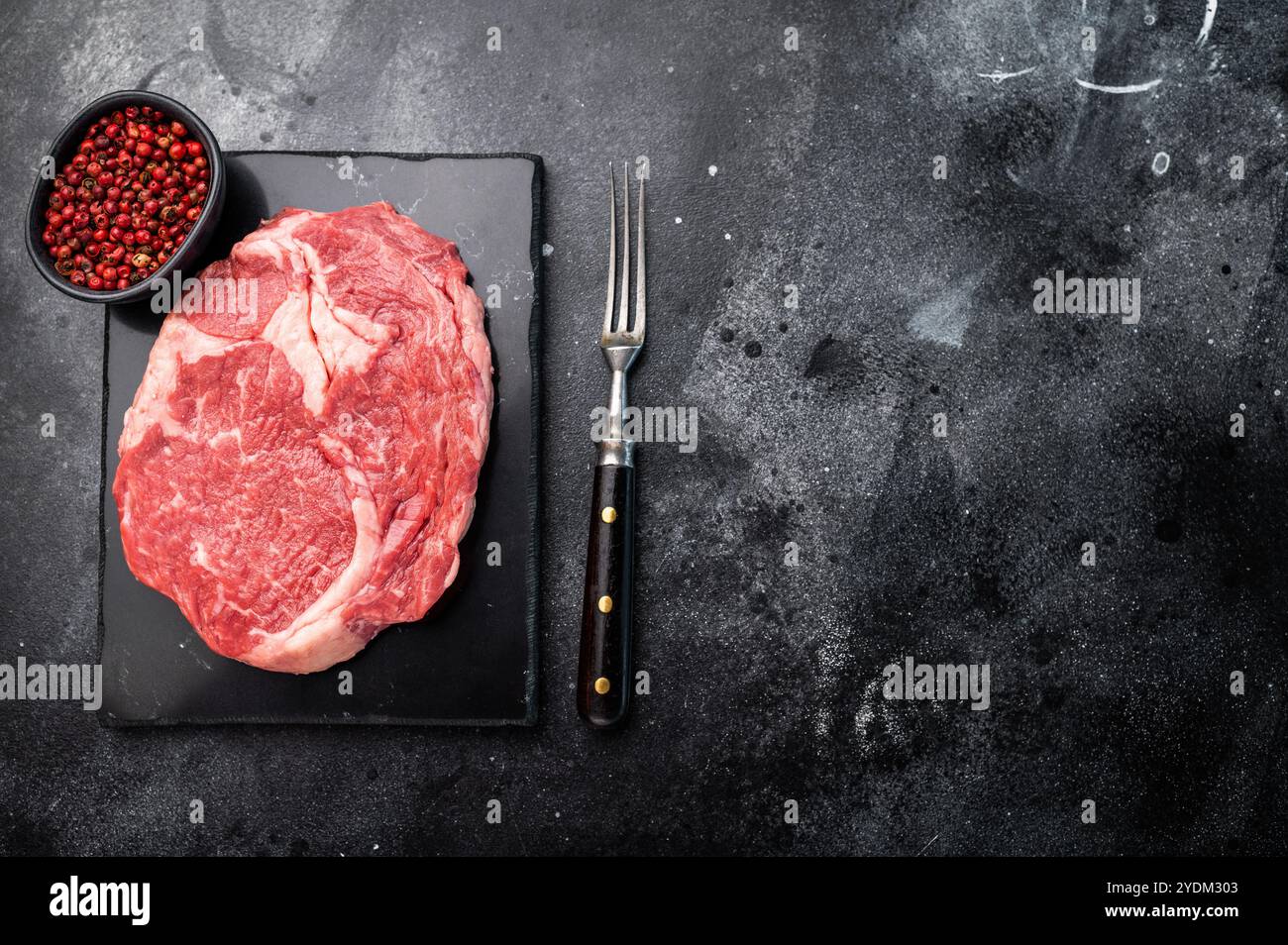 Raw Marbled Rib eye steak with spice, dry aged beef meat. black ...