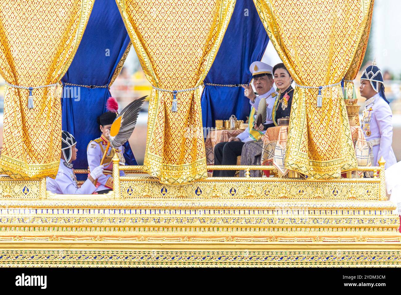 Oarsmen paddle the royal barge carrying King Maha Vajiralongkorn ...