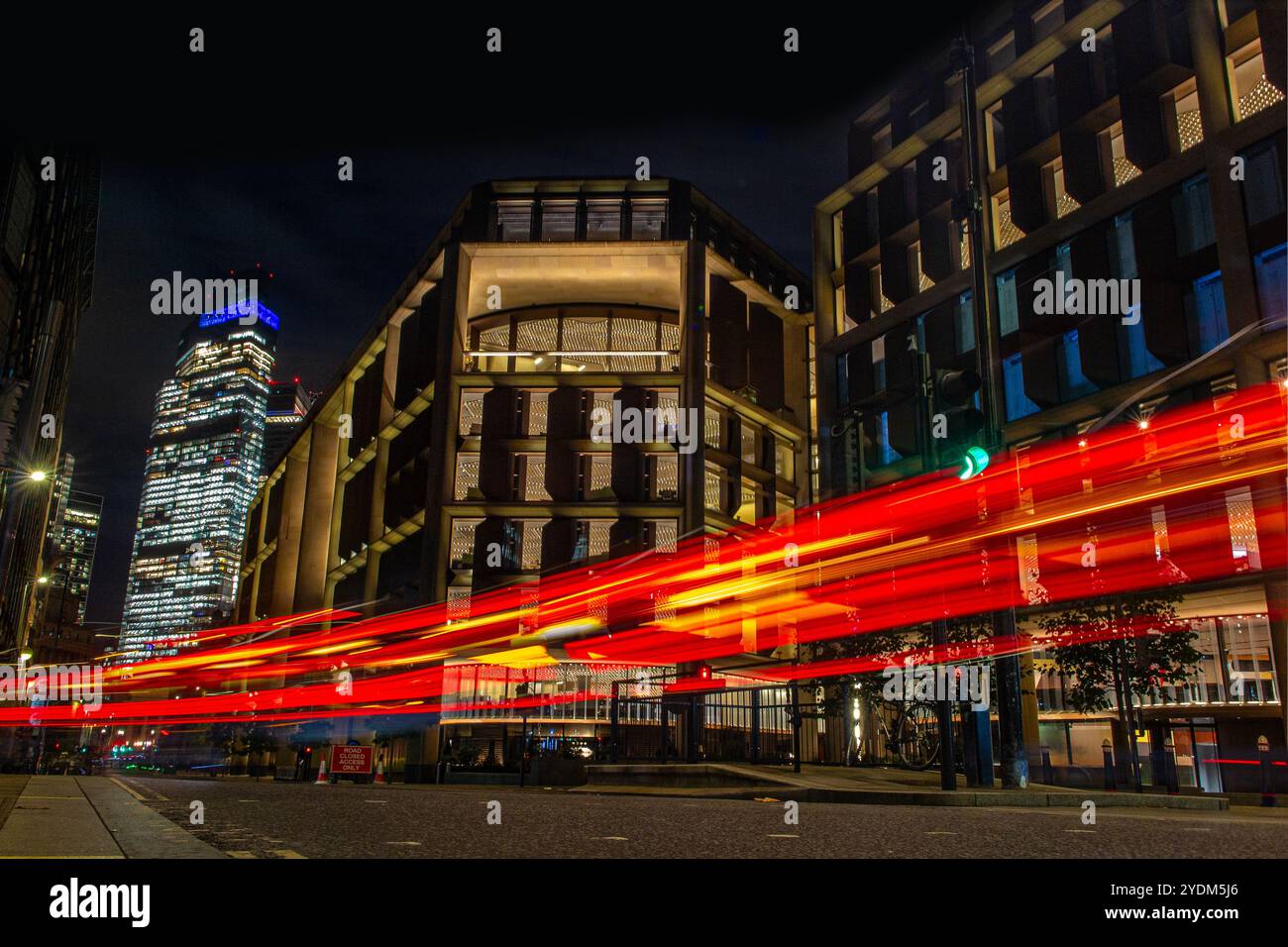 Light trails of cars at night outside the exterior of Bloomberg's ...